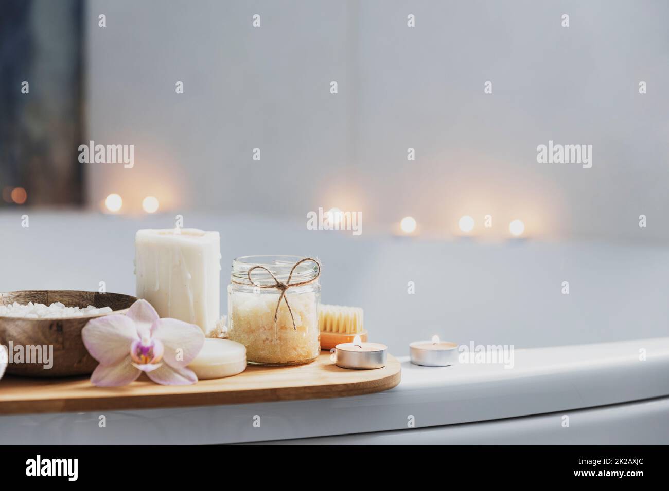 Hotel spa treatment or home bath procedure. Bathroom with accessories ...