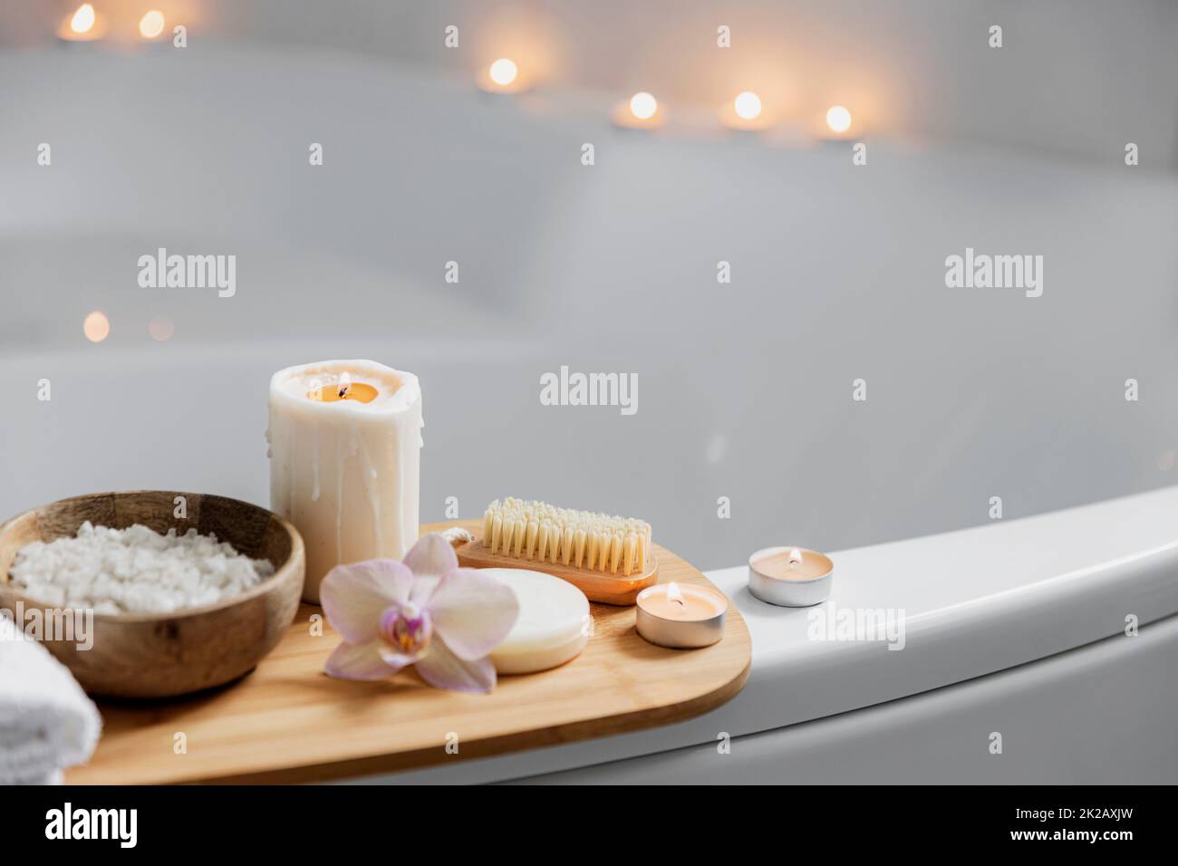 Hotel spa treatment or home bath procedure. Bathroom with accessories ...