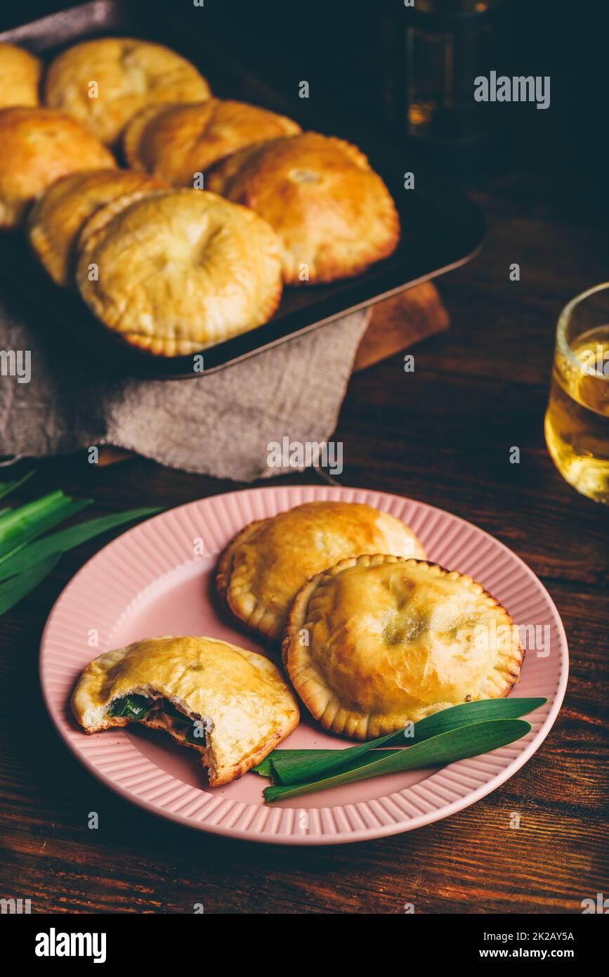 Freshly Baked Hand Pies Filled with Chives and Mushrooms. One Pie with ...