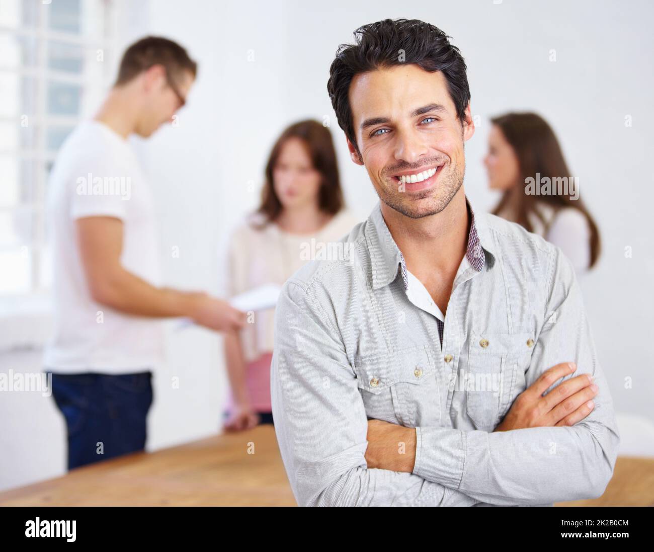 My team goes the extra mile. Portrait of a positive-looking young ...