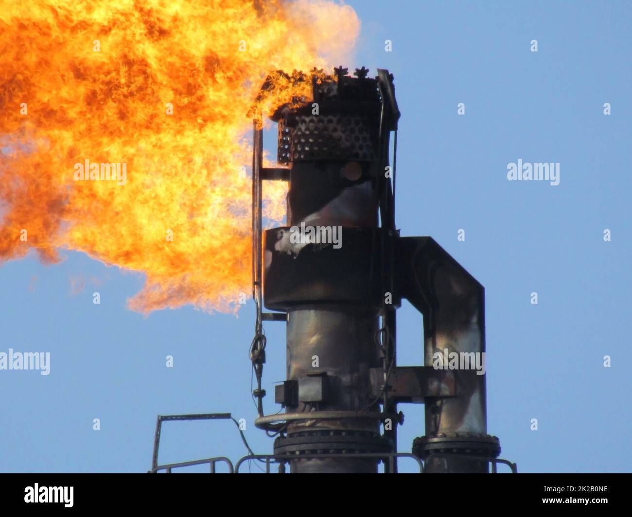 Torch system on an oil field Stock Photo - Alamy