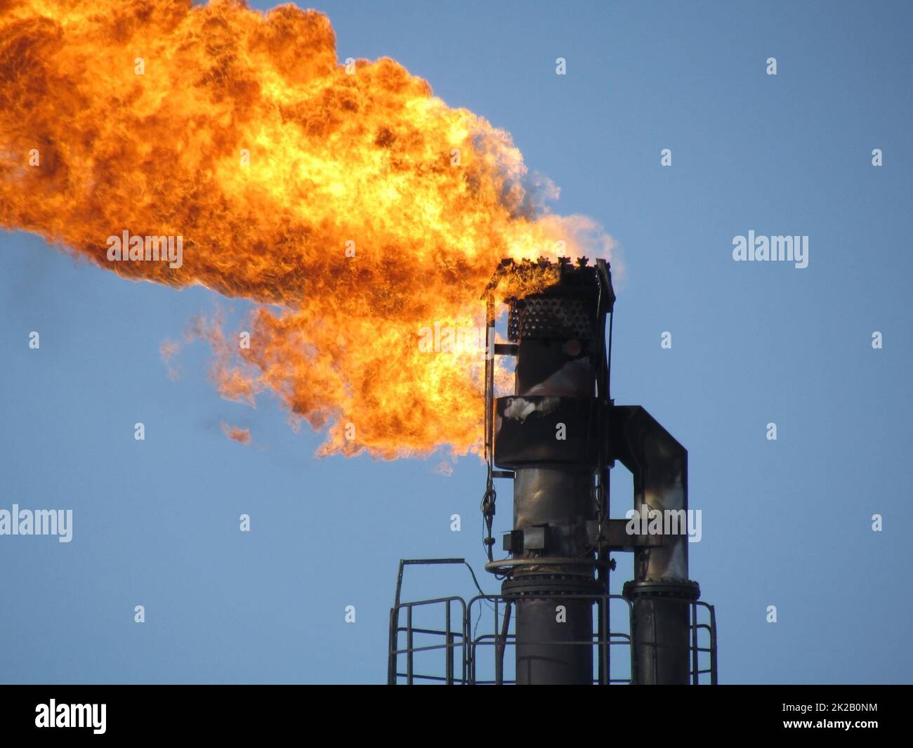 Torch system on an oil field Stock Photo - Alamy