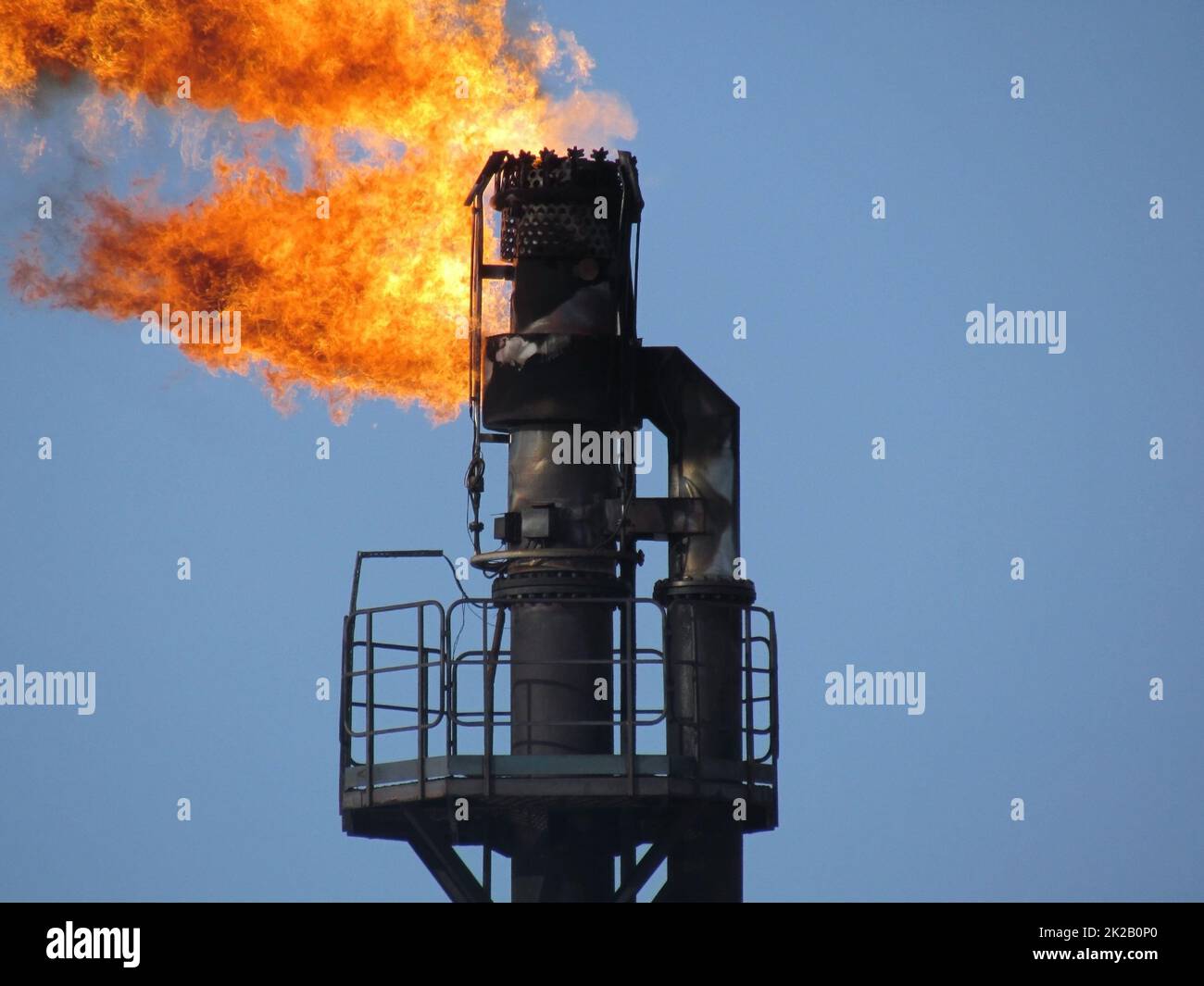 Torch system on an oil field Stock Photo - Alamy