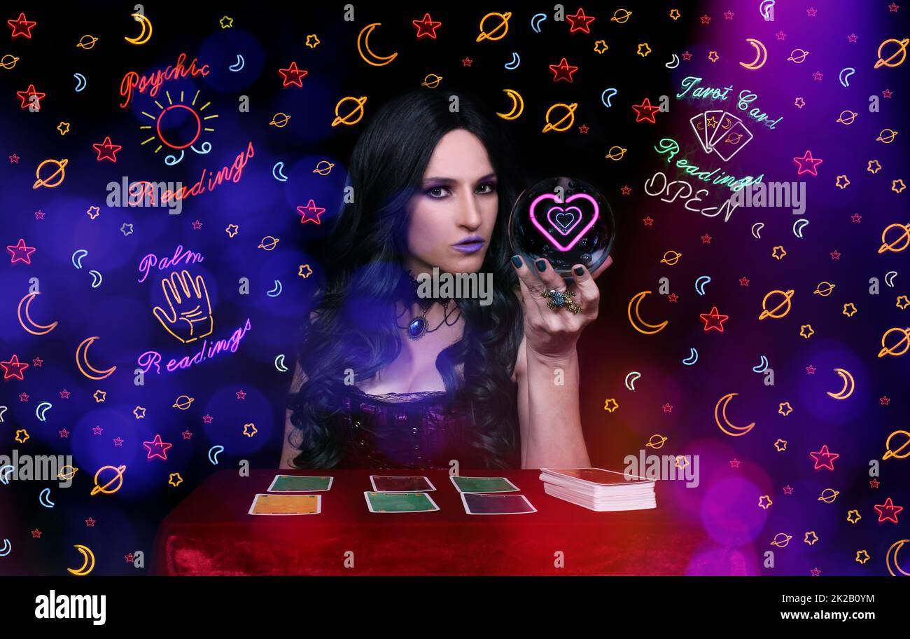 Psychic Tarot Card Reader With Neon Signs Stock Photo - Alamy