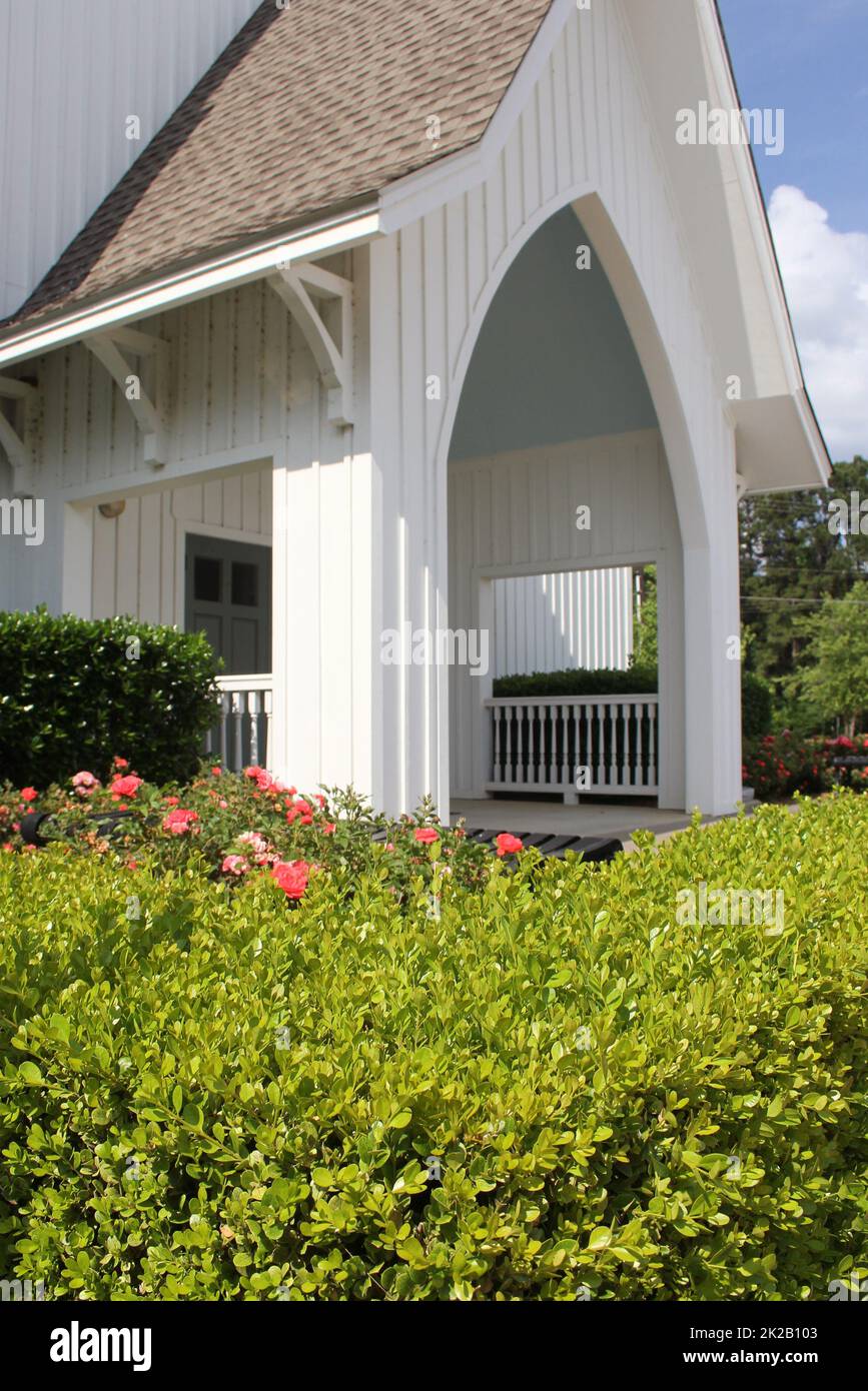 Small White Church Building Close up With Hedges and Roses Stock Photo ...