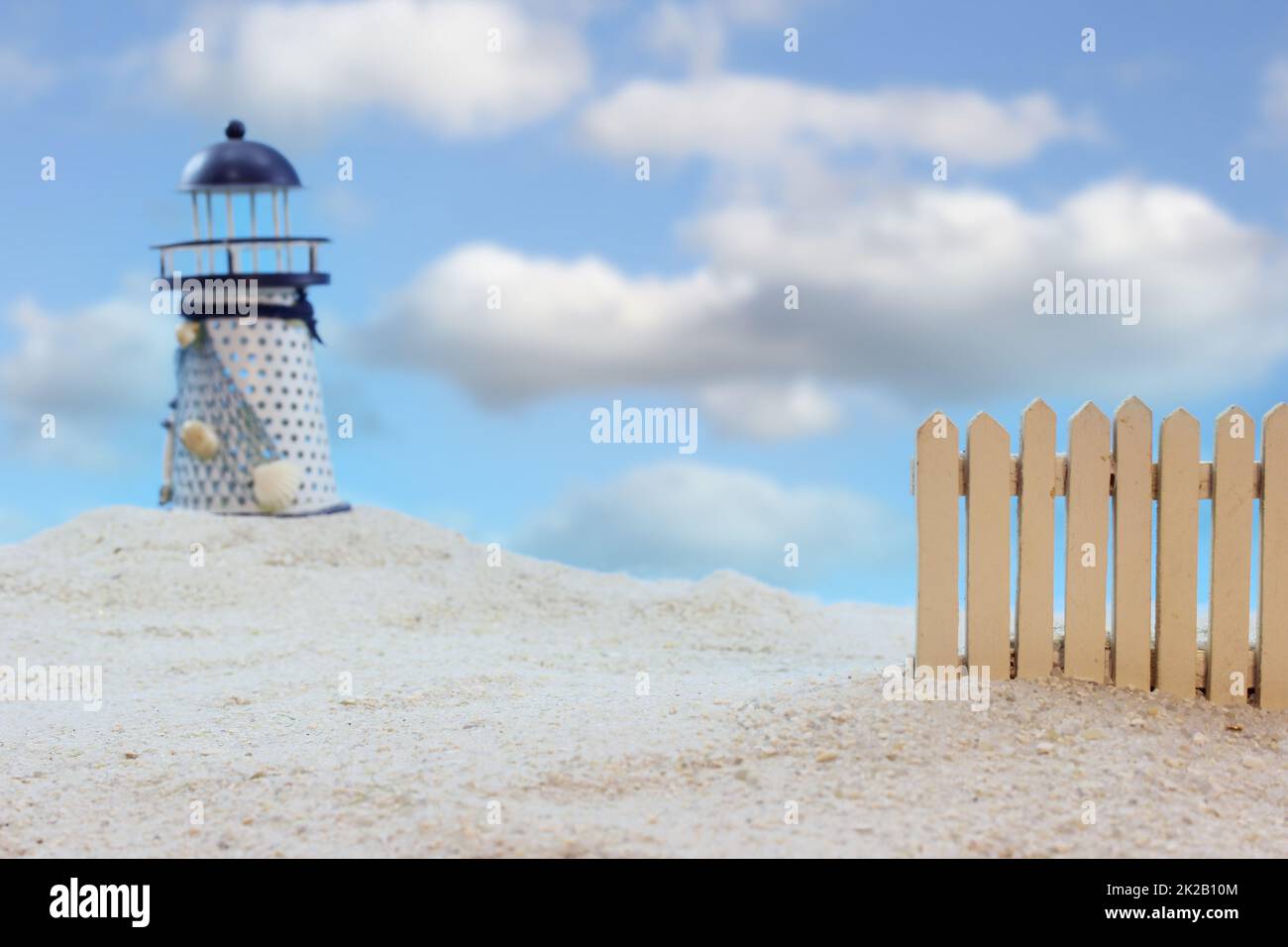 Lighthouse With Pickett Fence and Blue Sky Shallow DOF Stock Photo - Alamy