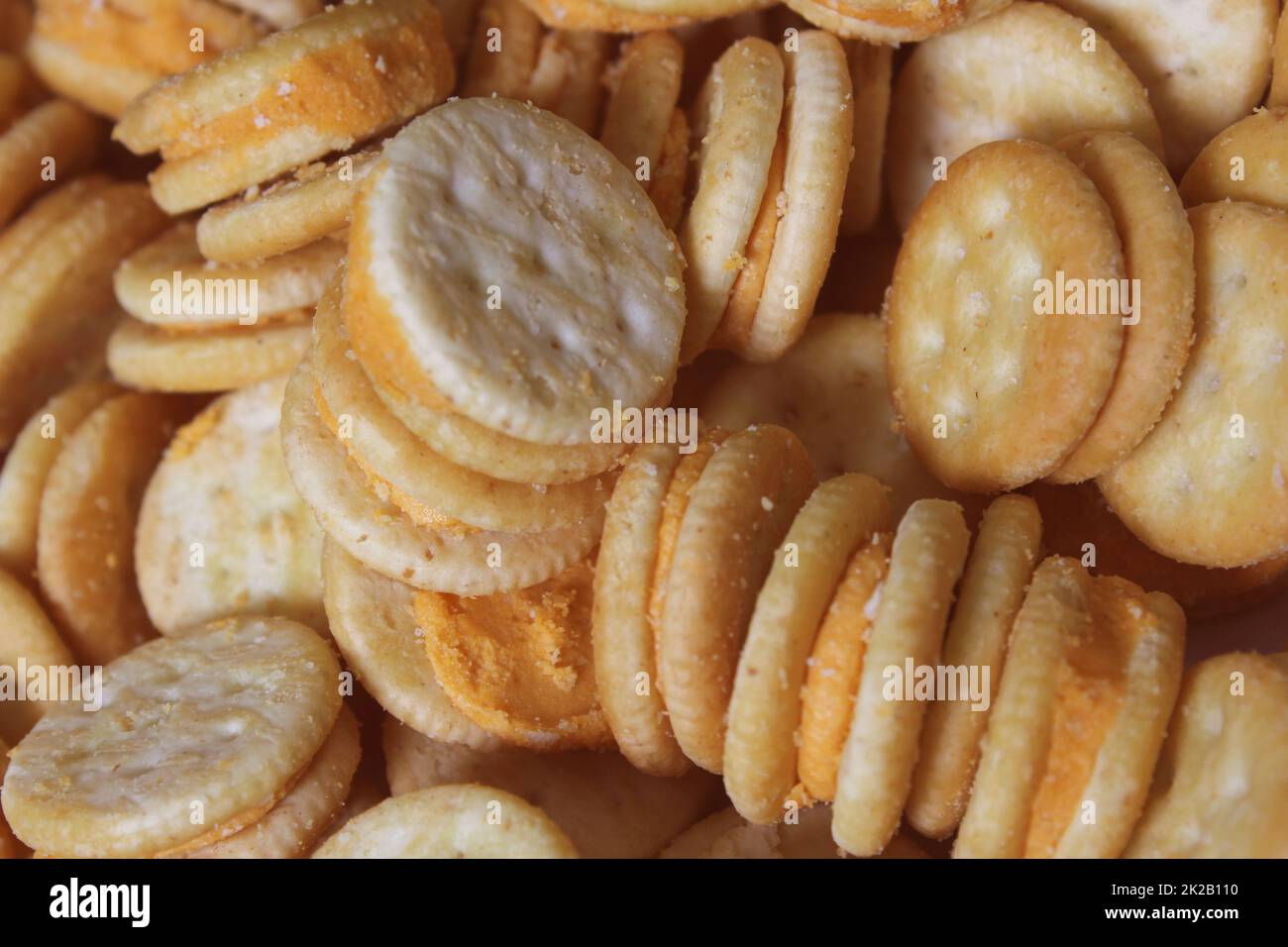 Pile of Cheese Snack Crackers Close up Stock Photo - Alamy