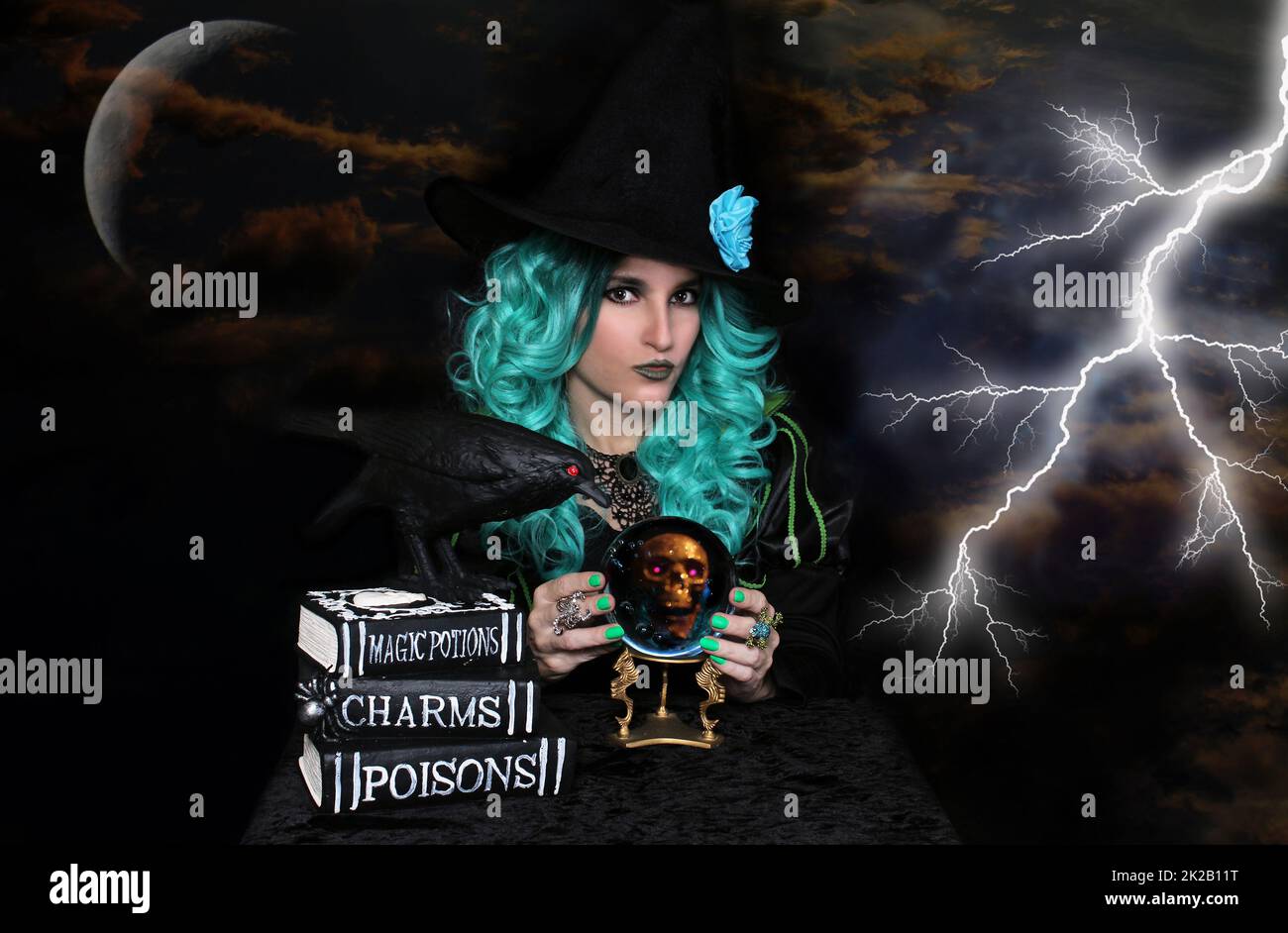 Witch With Crystal Ball and Spell Books Stock Photo - Alamy