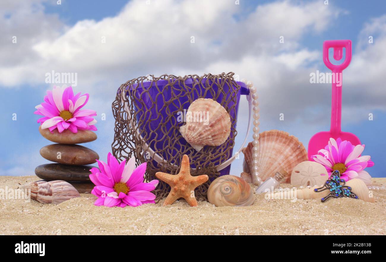 Sand Pail With Net and Sea Shells on Sand With Sky Background Stock ...