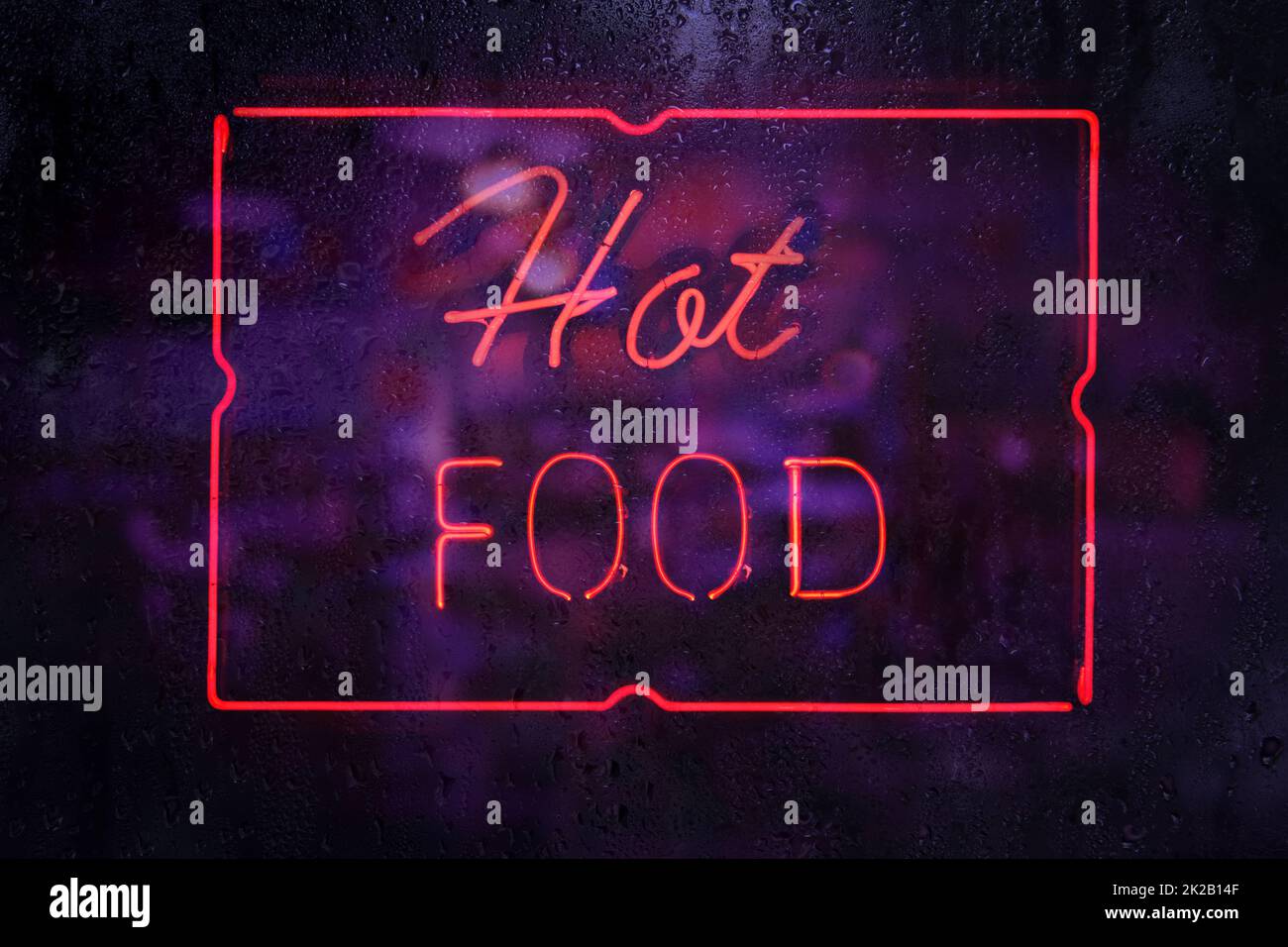 Vintage Neon Hot Food Sign in Rainy Window Stock Photo - Alamy