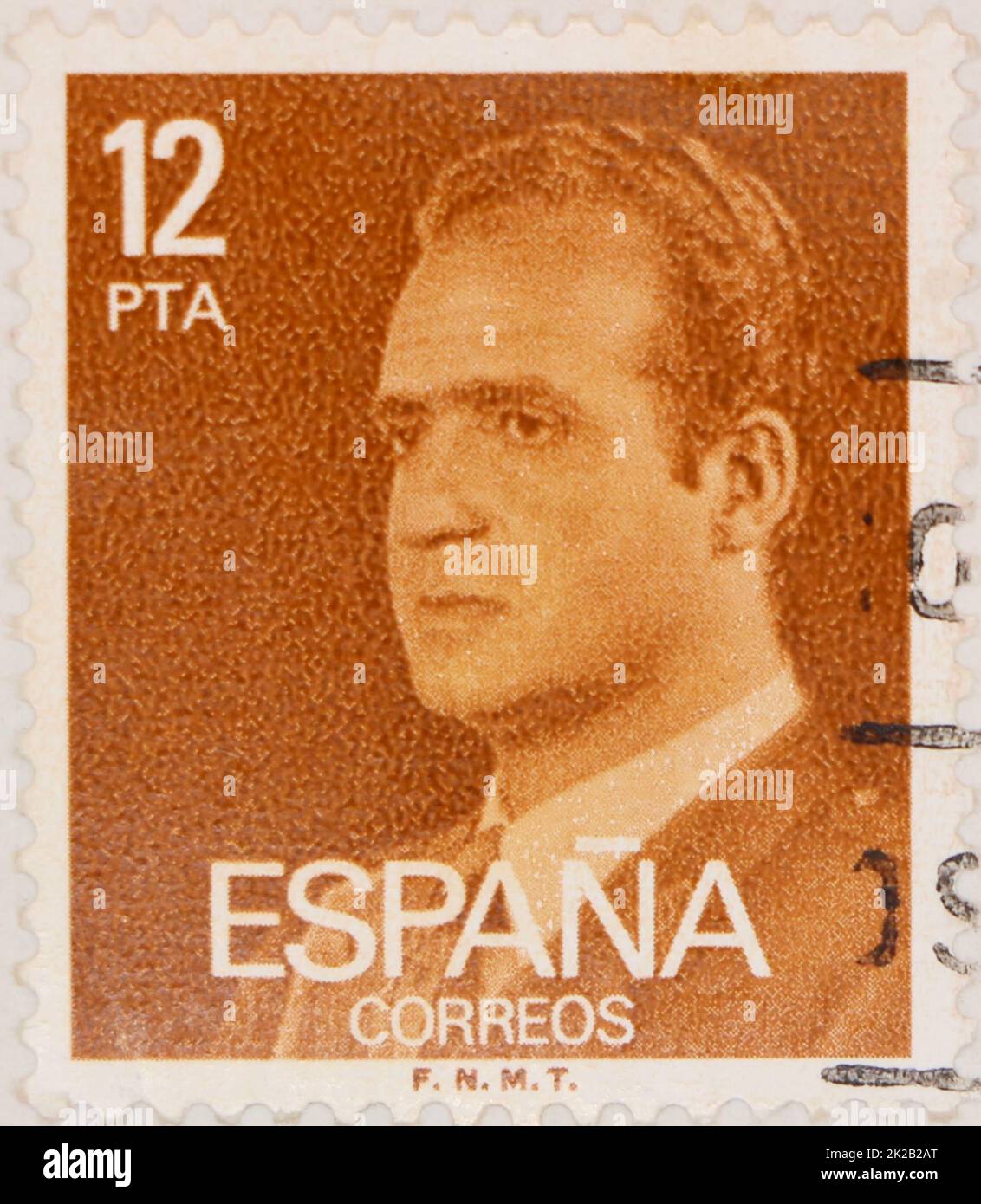 Photo of an orange 12 pesetas Spanish postage stamp featuring an image ...