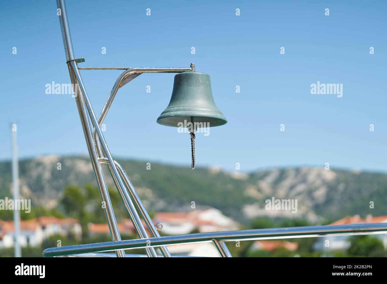 Ship bell of a sailing yacht in the harbor of the town of Rab in ...