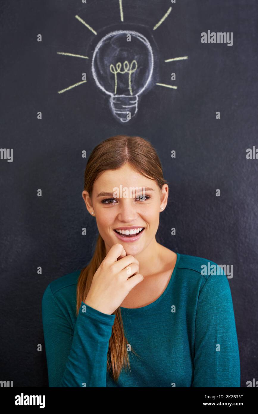 Using illustrations to teach her students. an attractive young woman ...