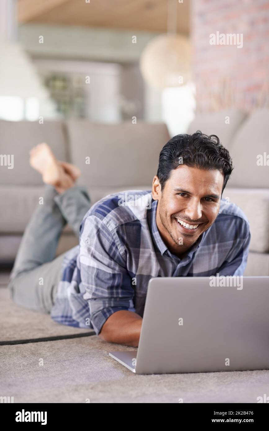 Where would we be without the internet. A young man using his laptop at ...