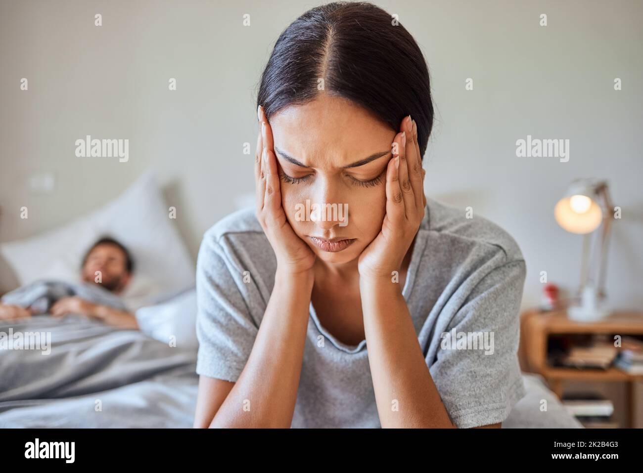 Woman, insomnia or headache pain on bed from stress, burnout or health ...