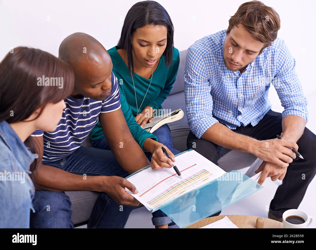 Figuring out their high points. a young group of designers having a ...