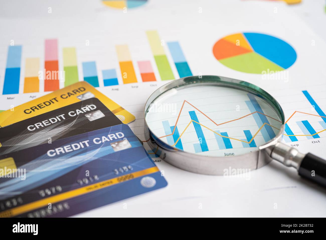 Credit card on chart and graph paper. Finance development, Banking ...