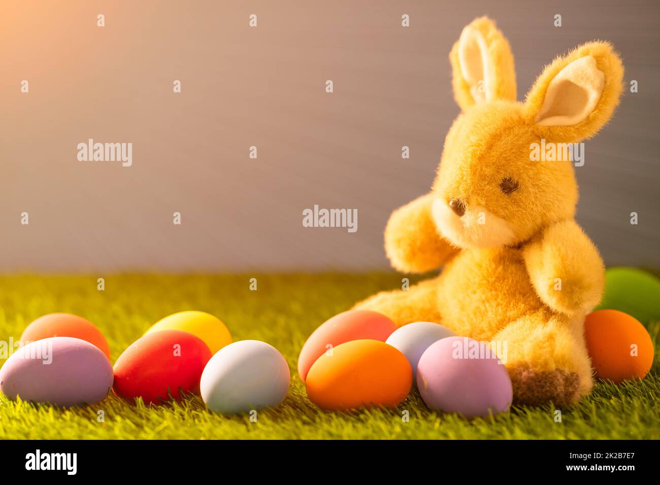 Easter eggs and rabbit on grass Stock Photo - Alamy