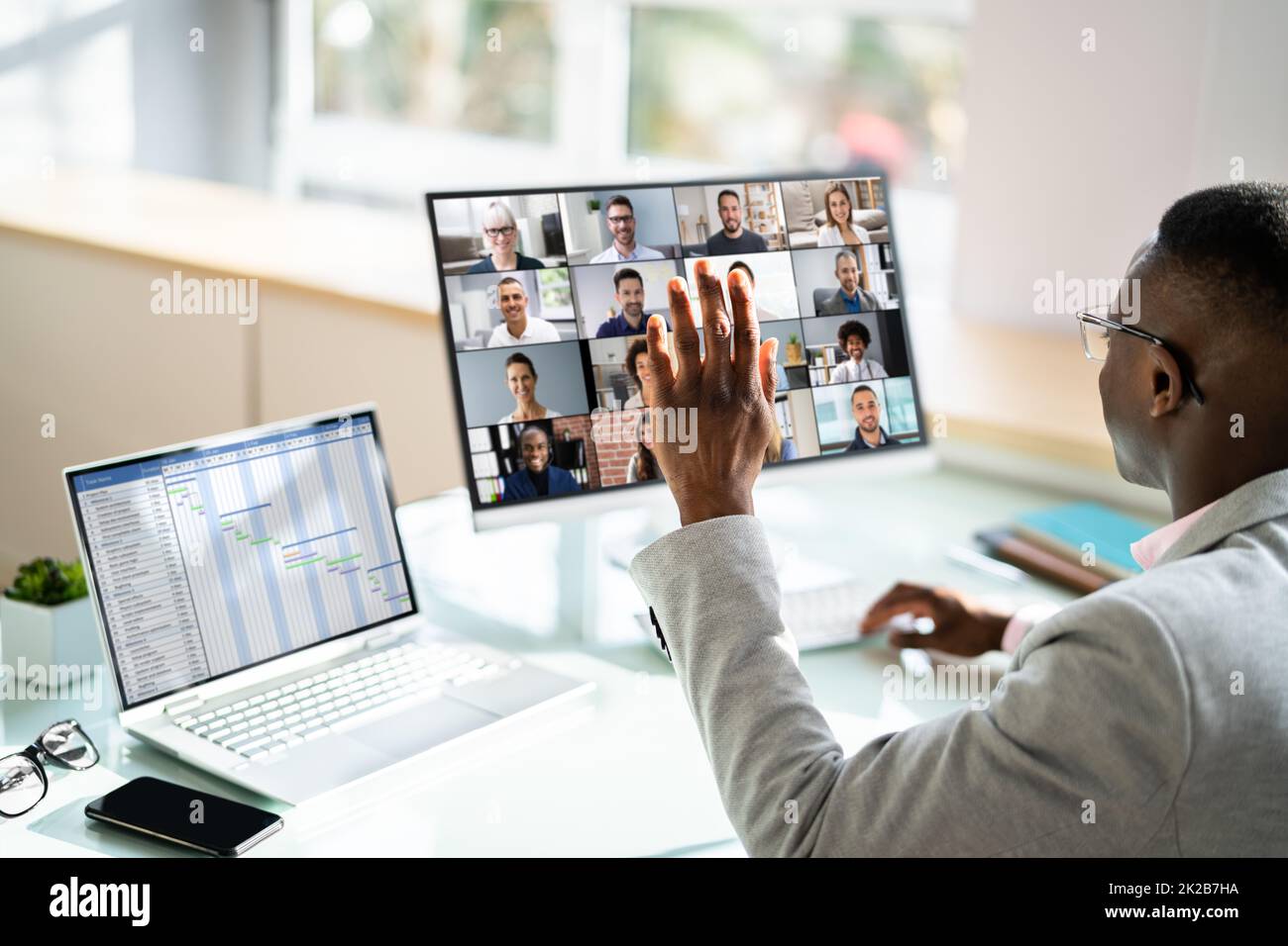 Virtual Video Conference Interview In Office Waving Hand Stock Photo ...