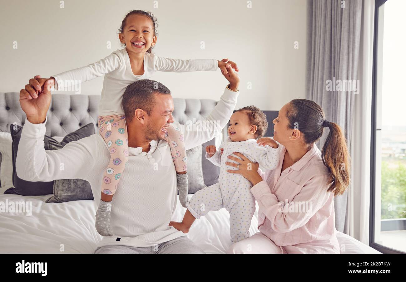 Comic family, happy and bedroom portrait while relax in home together ...