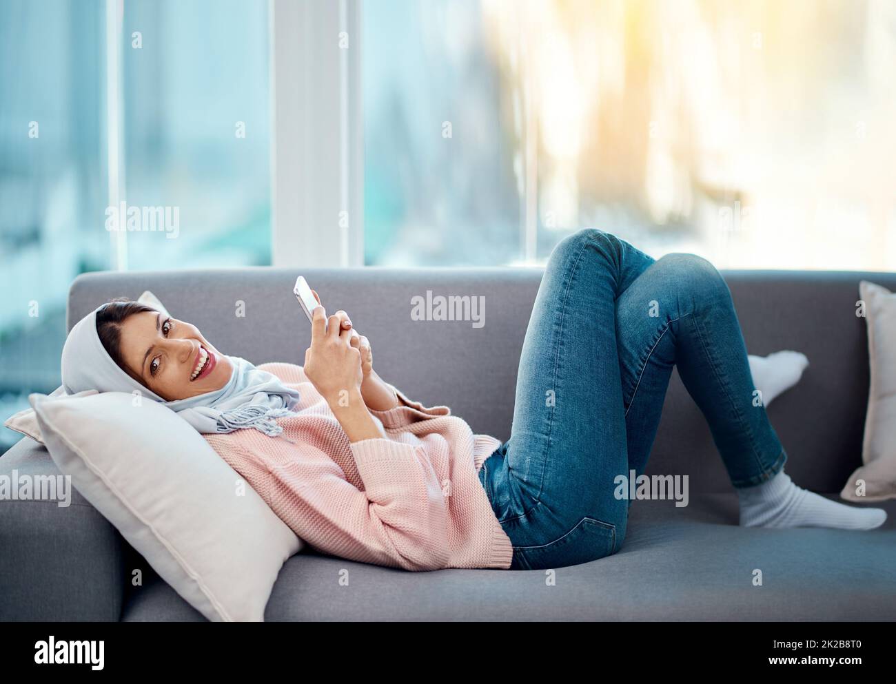 Women chilling on couch hi-res stock photography and images - Alamy