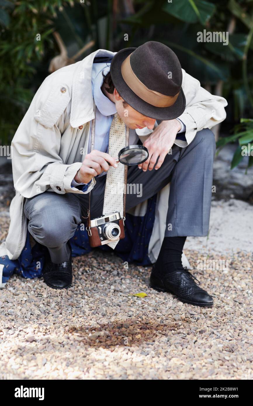 Detective looking clues magnifying glass hi-res stock photography and ...