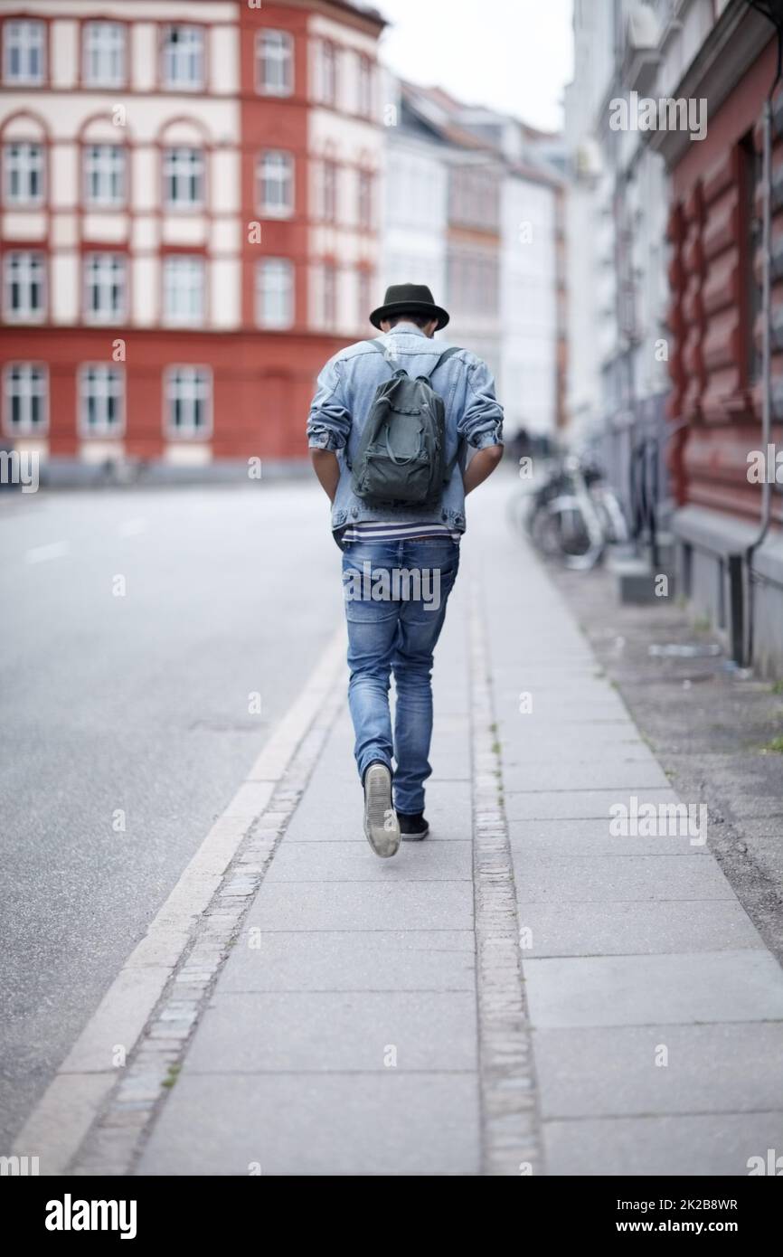 Back view of young man strolling hi-res stock photography and images ...