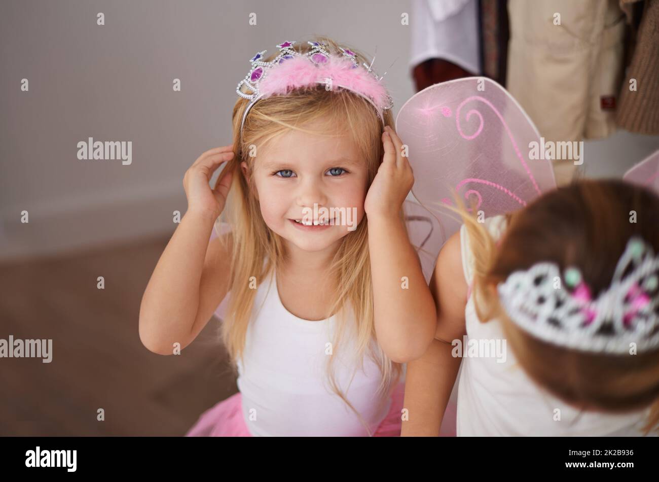 Having fun in imagination land. Cropped shot of little girls wearing ...