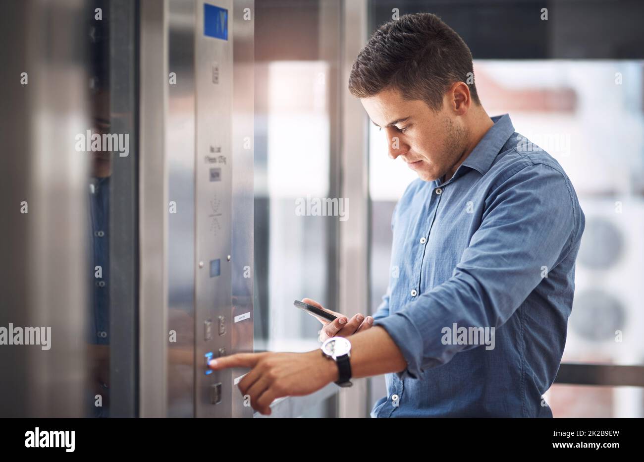 Hes heading straight to the top. Shot of a young businessman using a ...