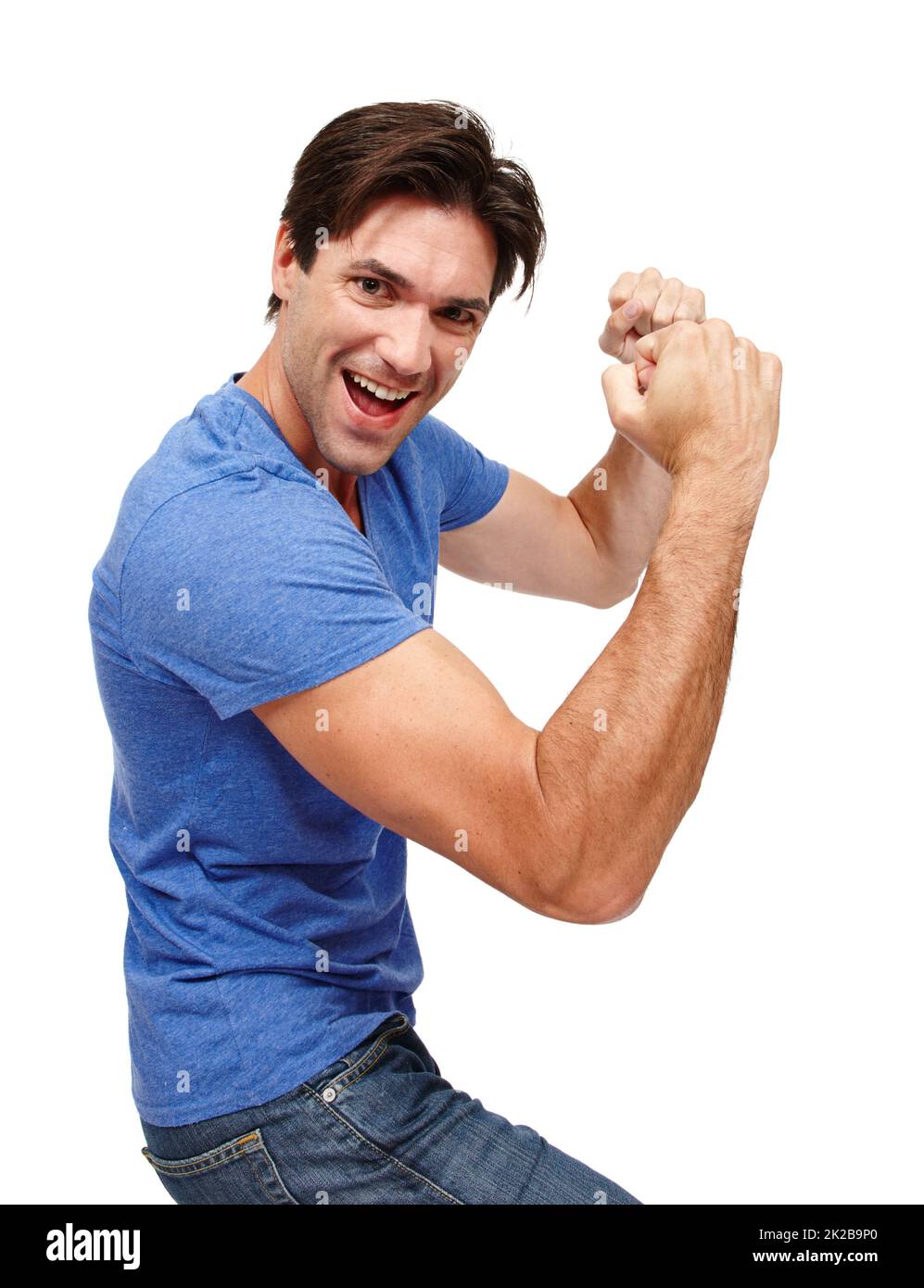 Excited young man punching the air isolated on white background Stock ...