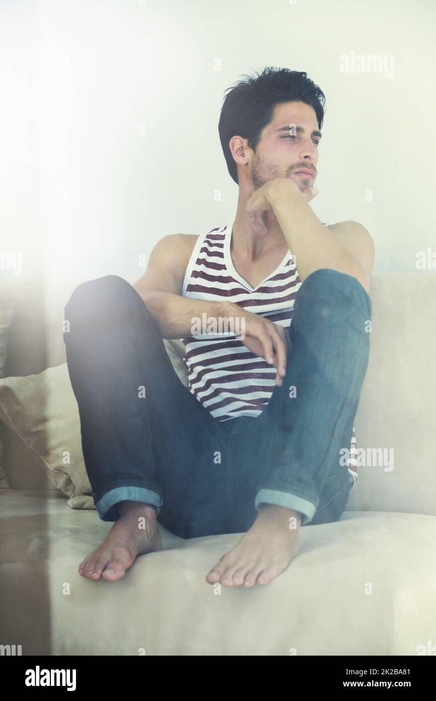 Man feet up sofa hi-res stock photography and images - Alamy