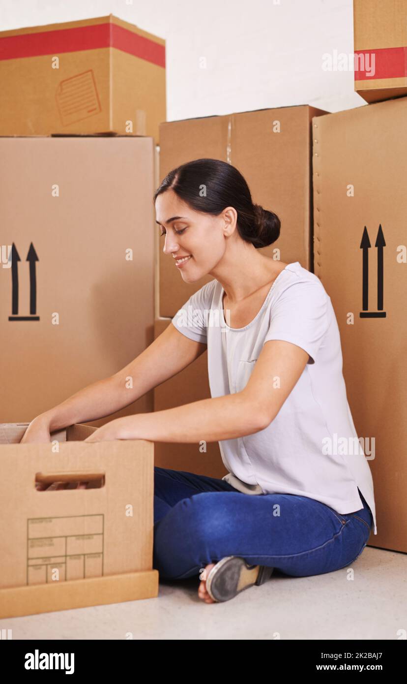 Person surrounded by boxes hi-res stock photography and images - Alamy