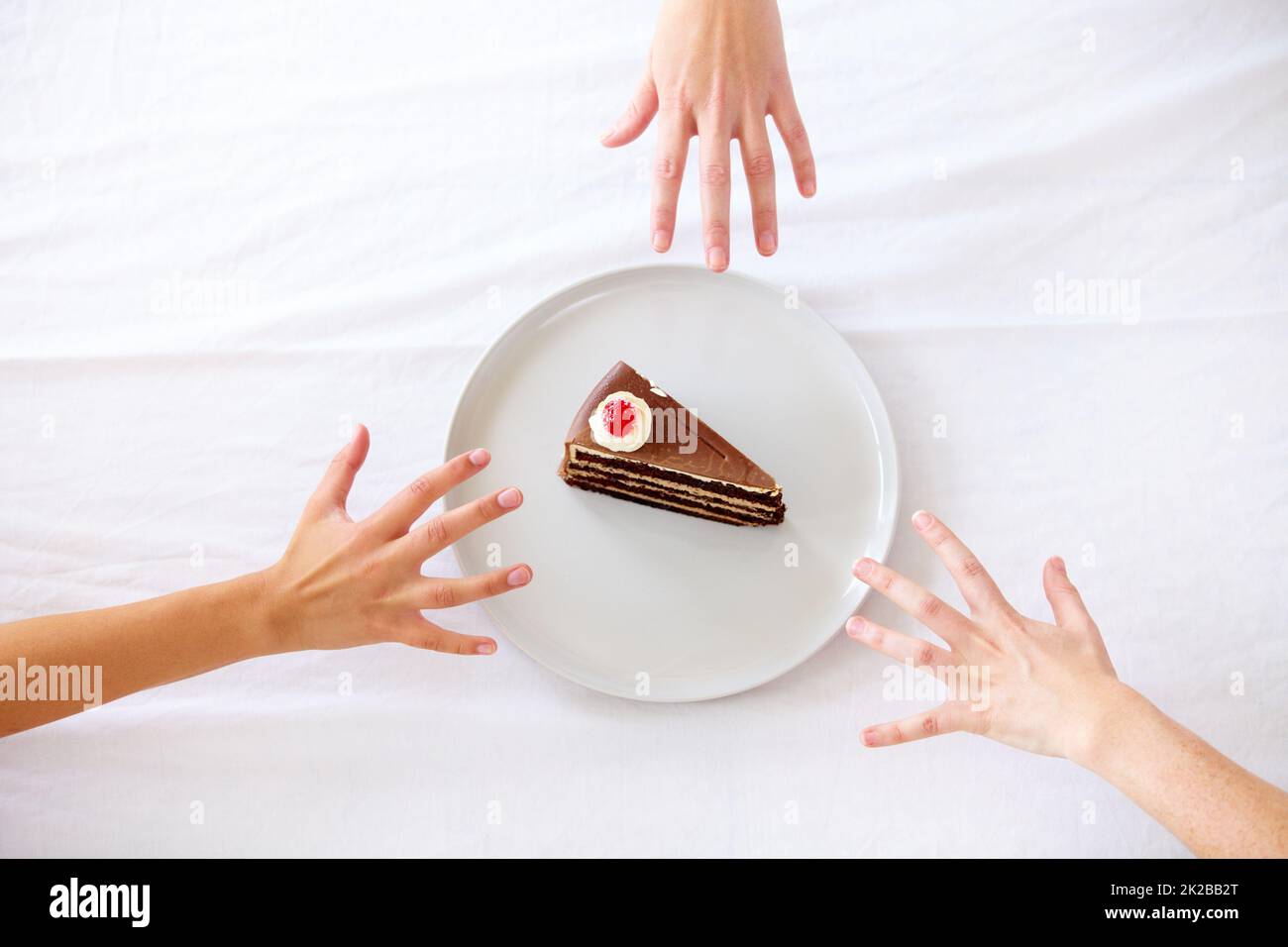 Hand reaching cake hi-res stock photography and images - Alamy