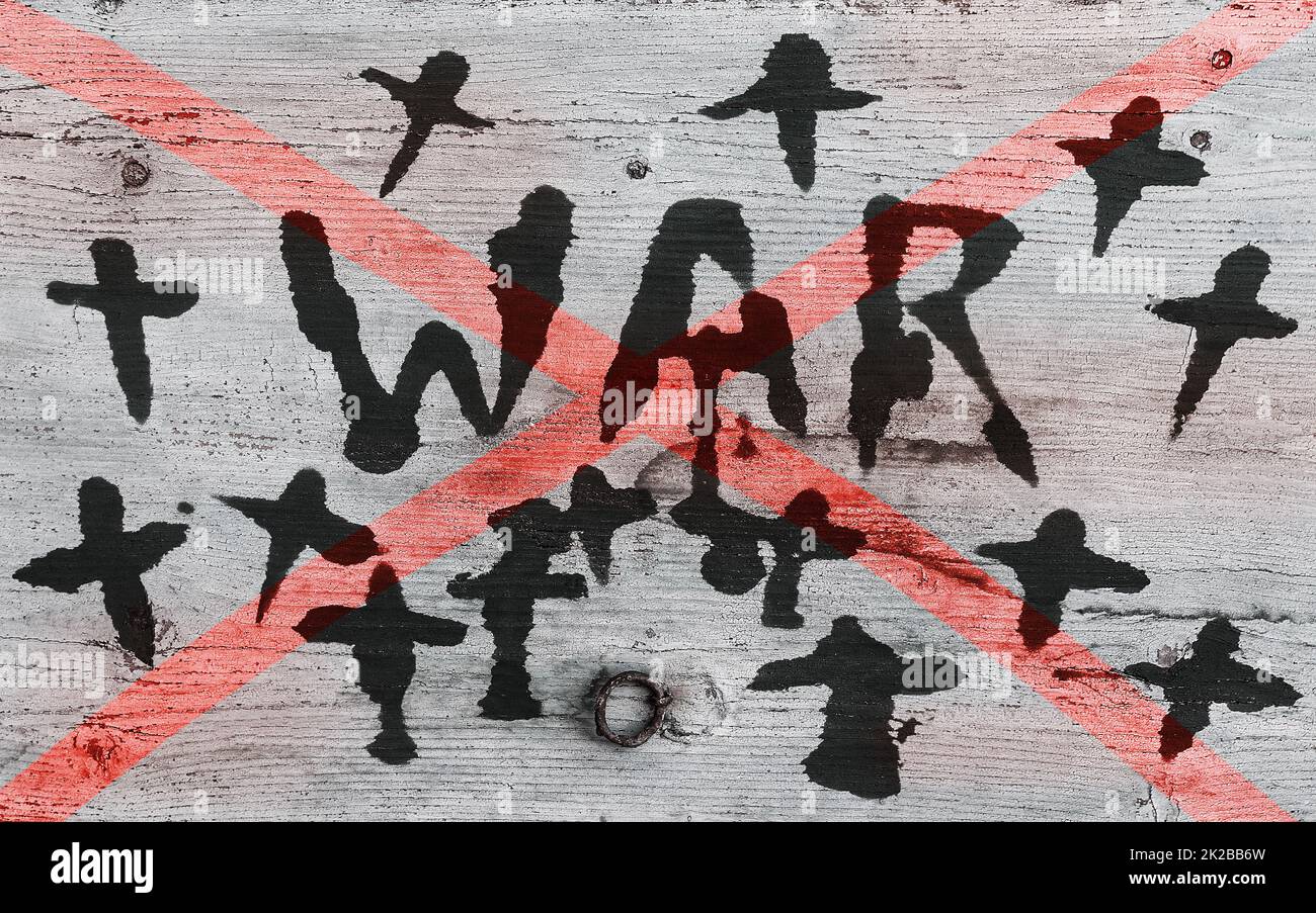 War. A wooden sign with the inscription WAR crossed out and crosses ...