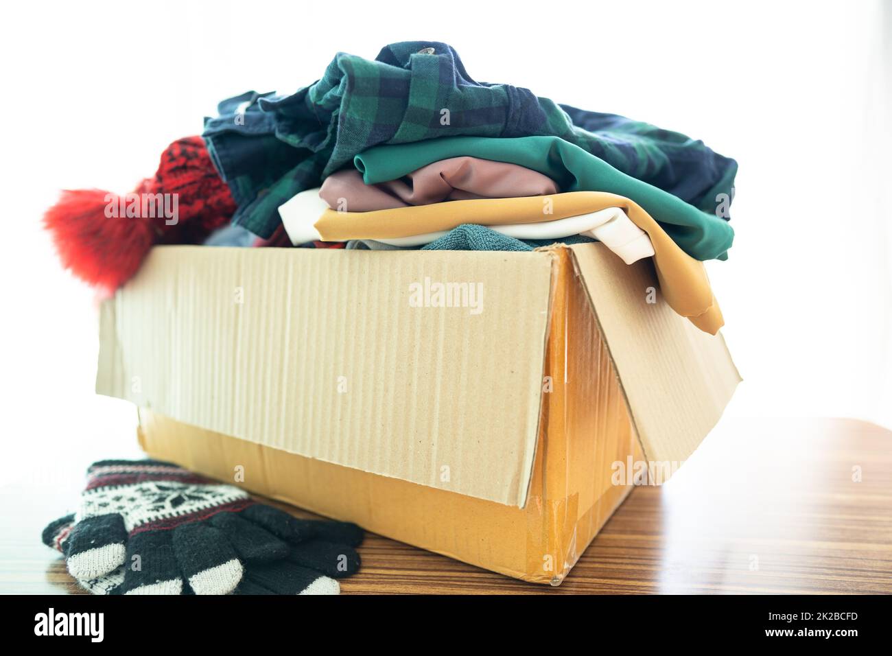 Donation box with used clothes at home to support help for poor people ...