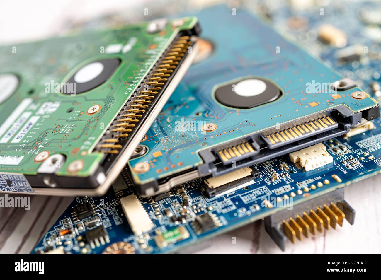Technician repairing inside of mobile phone by soldering iron ...