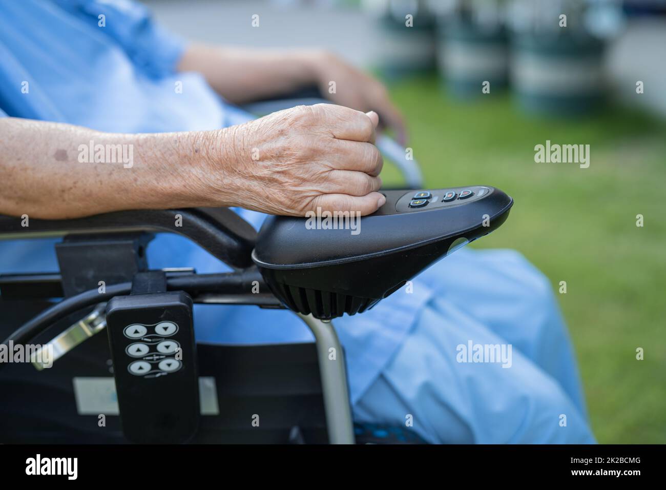 Asian senior or elderly old lady woman patient on electric wheelchair ...