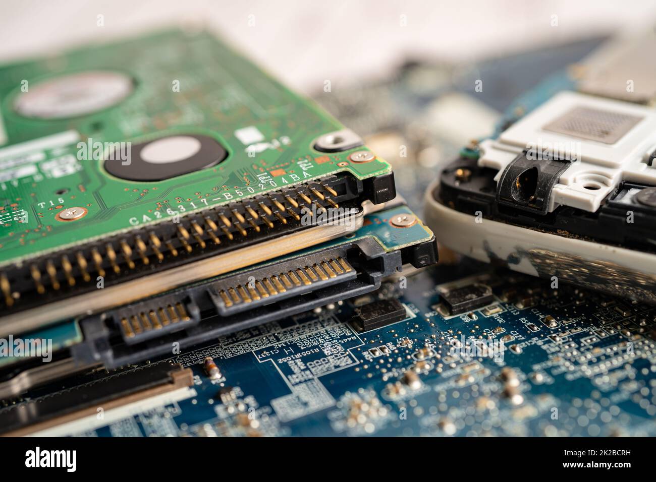 Technician repairing inside of mobile phone by soldering iron ...