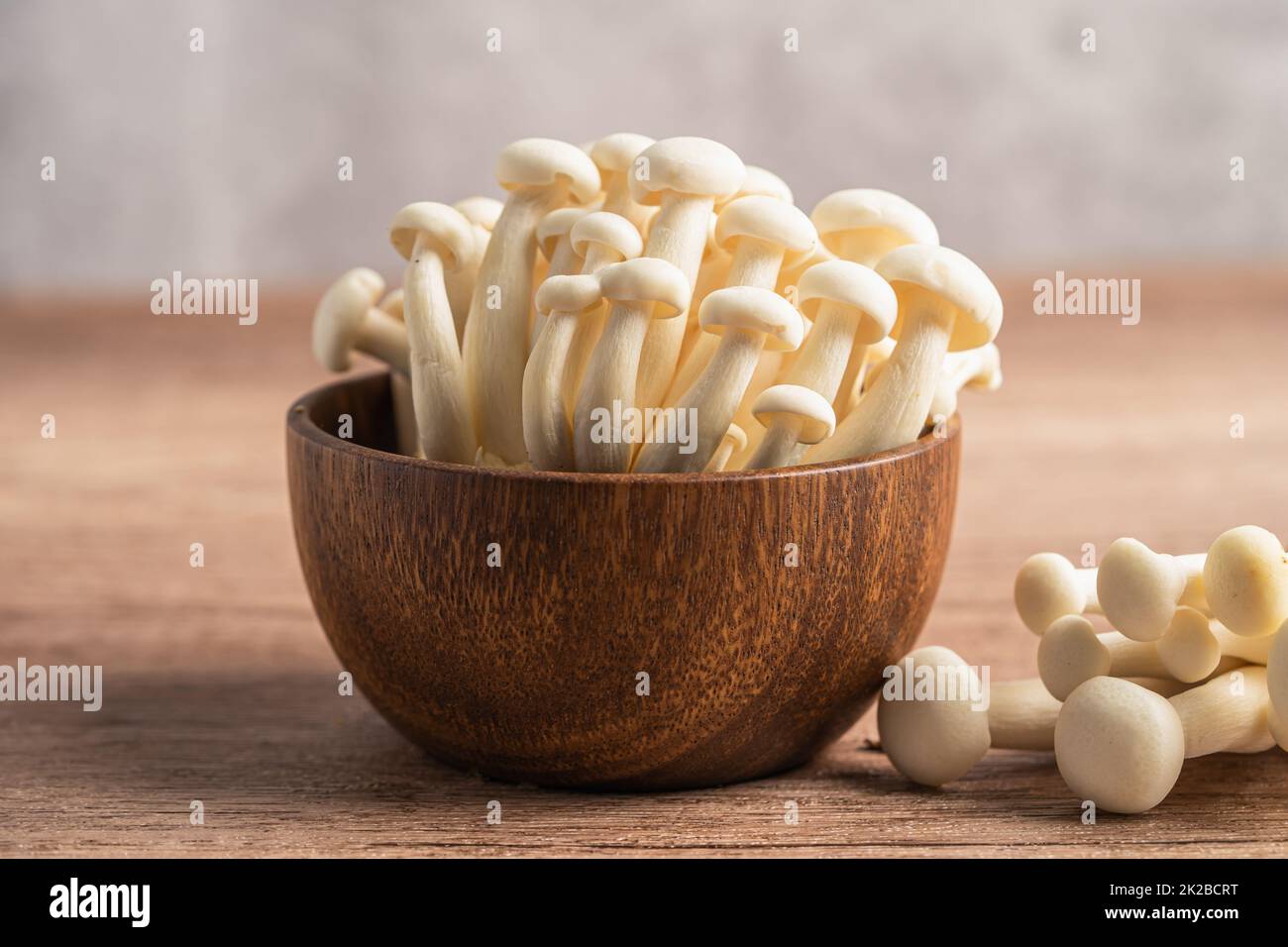 Shimeji, Fresh white bunapi mushrooms from Asia in wooden bowl Stock ...