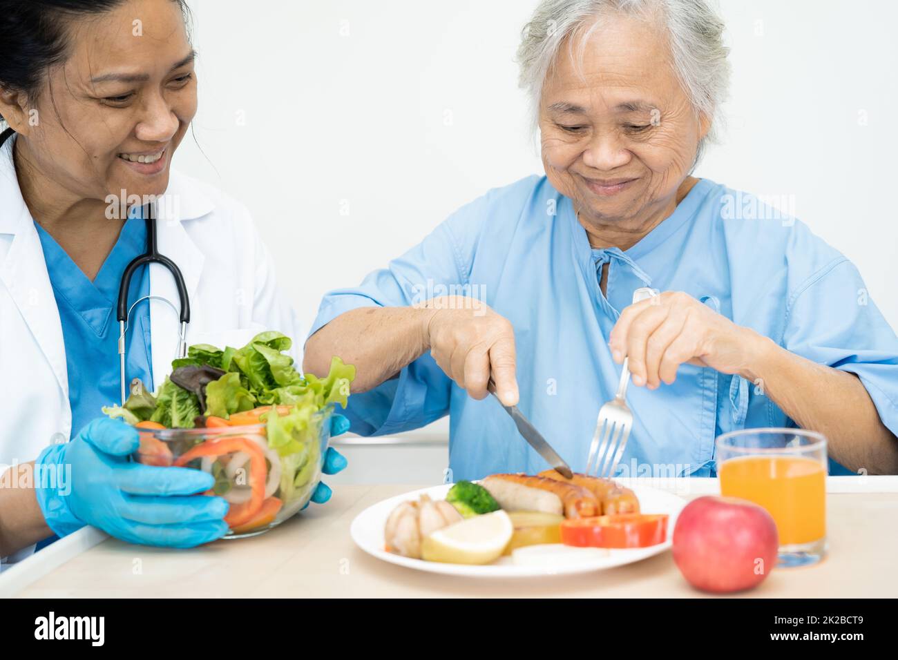 Man eating on hospital bed hi-res stock photography and images - Alamy