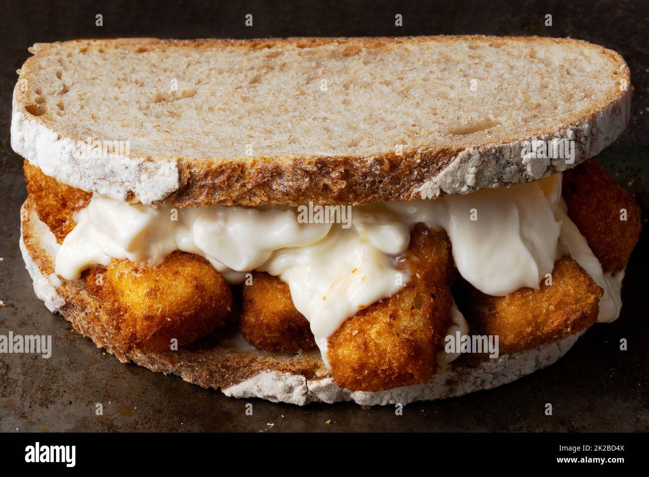 rustic golden english fish fingers sandwich Stock Photo - Alamy