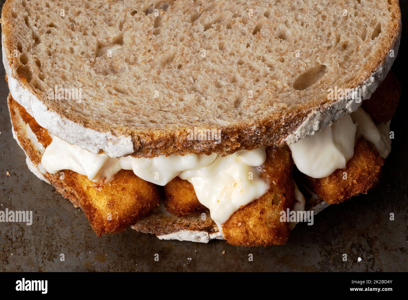 rustic golden english fish fingers sandwich Stock Photo - Alamy