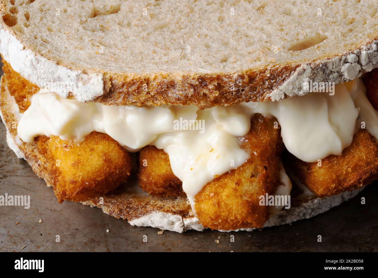 rustic golden english fish fingers sandwich Stock Photo - Alamy