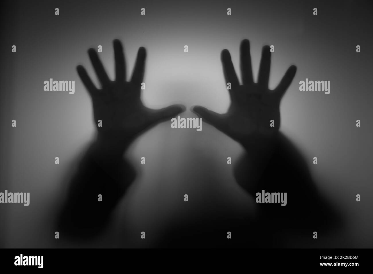 Shadow hands through glass Stock Photo - Alamy