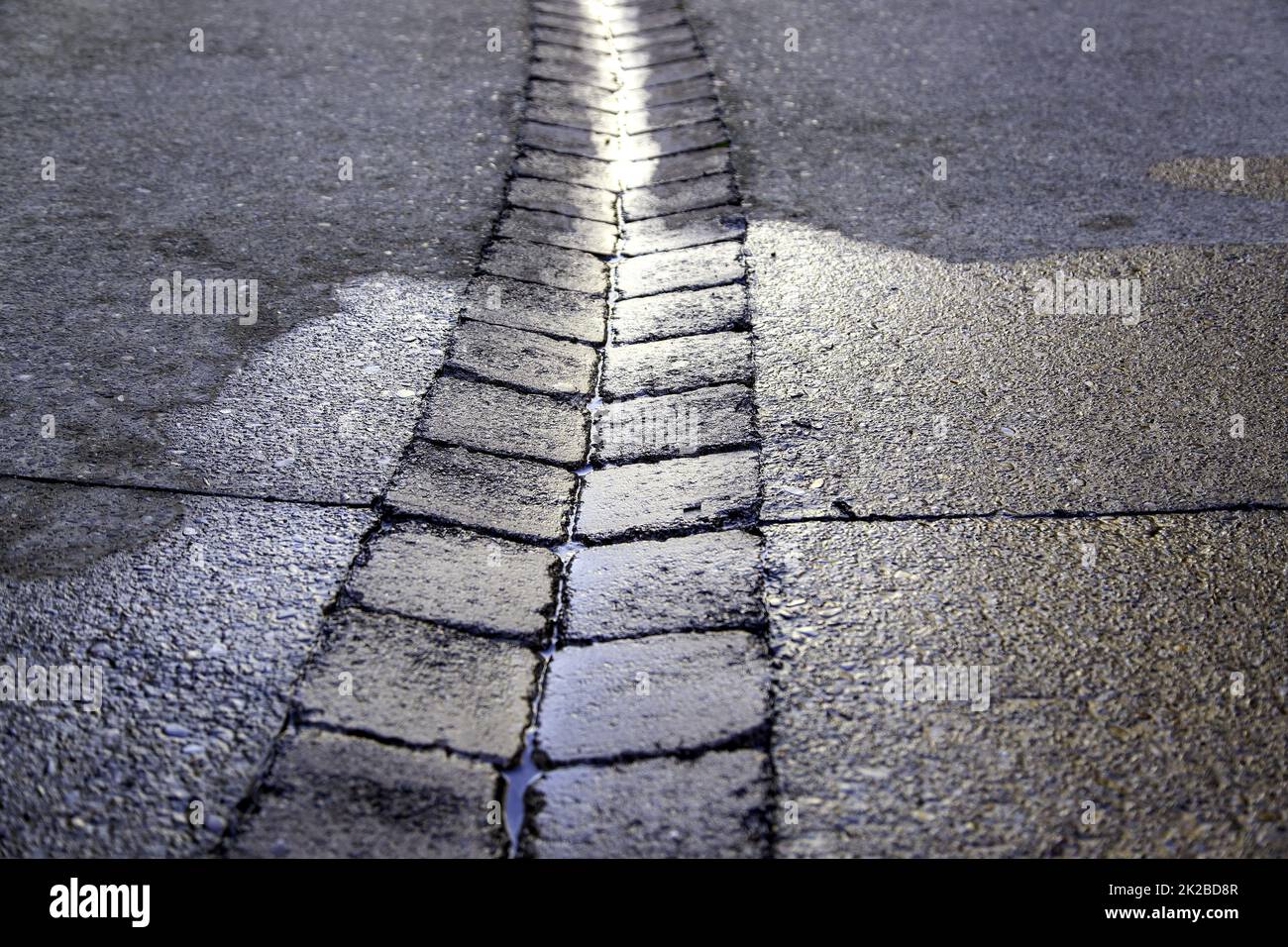 Wet stone street Stock Photo - Alamy