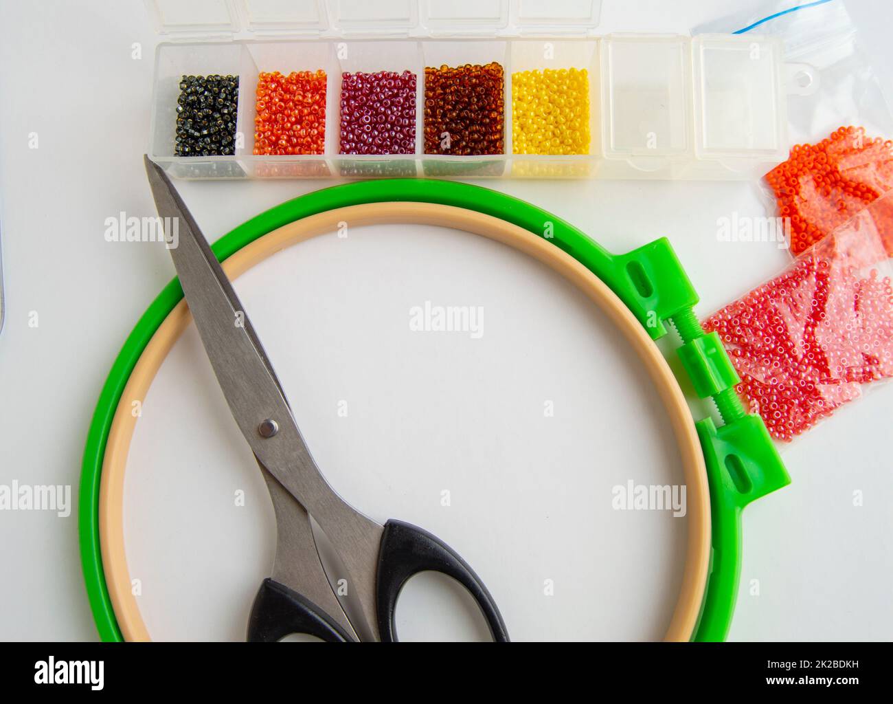 Flat lay needlework and embroidery accessories, scissors hoops and ...