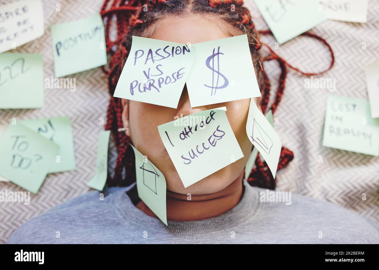 Black woman tired with sticky note on face, motivation for success and ...