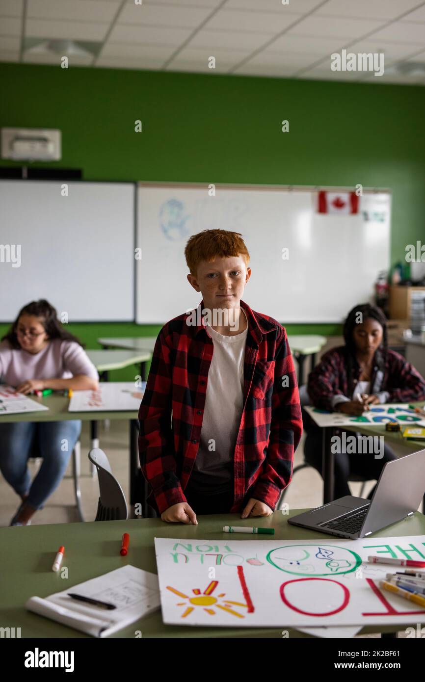 Child standing in front of class hi-res stock photography and images ...