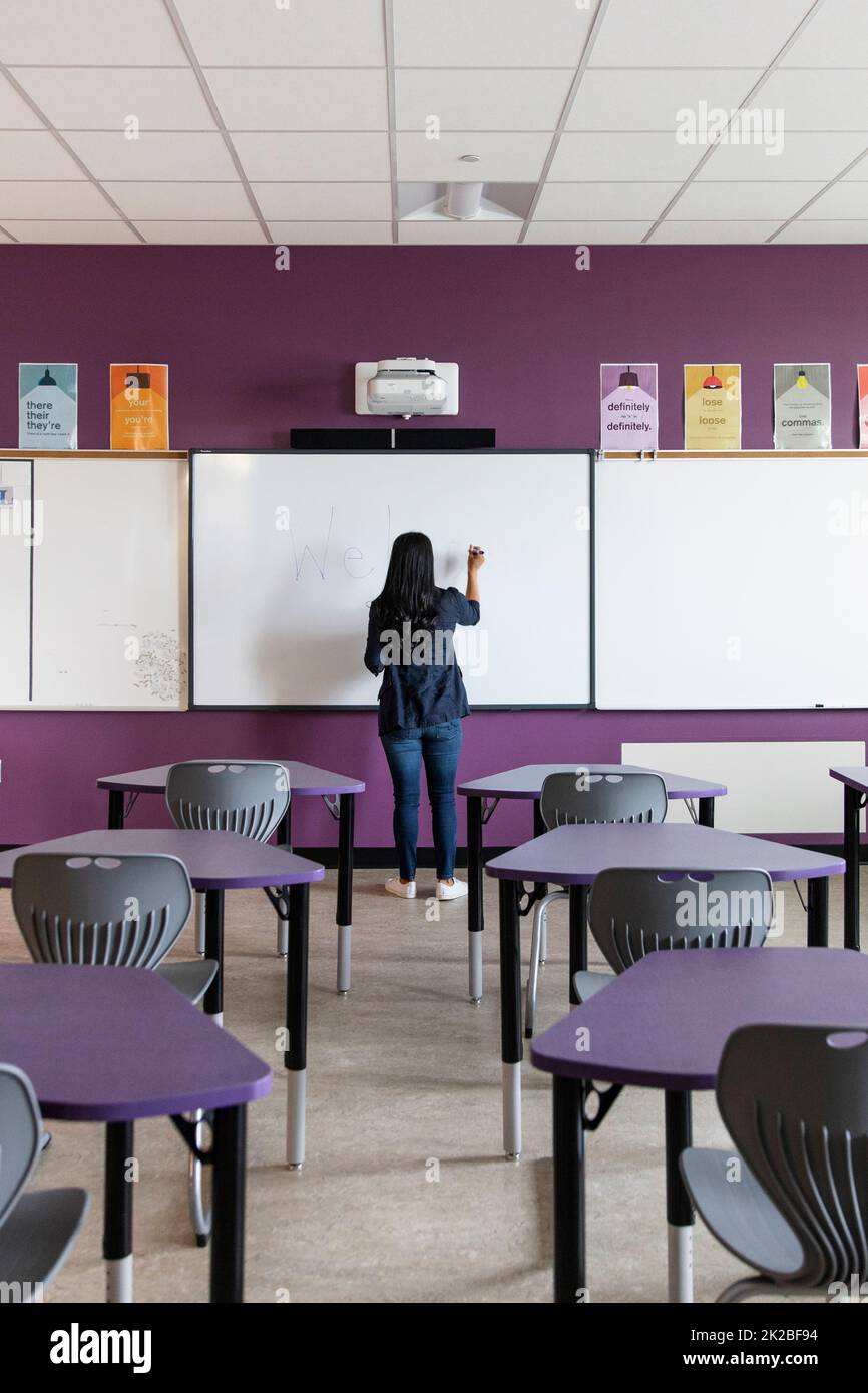 Portrait teacher writing on whiteboard hi-res stock photography and ...