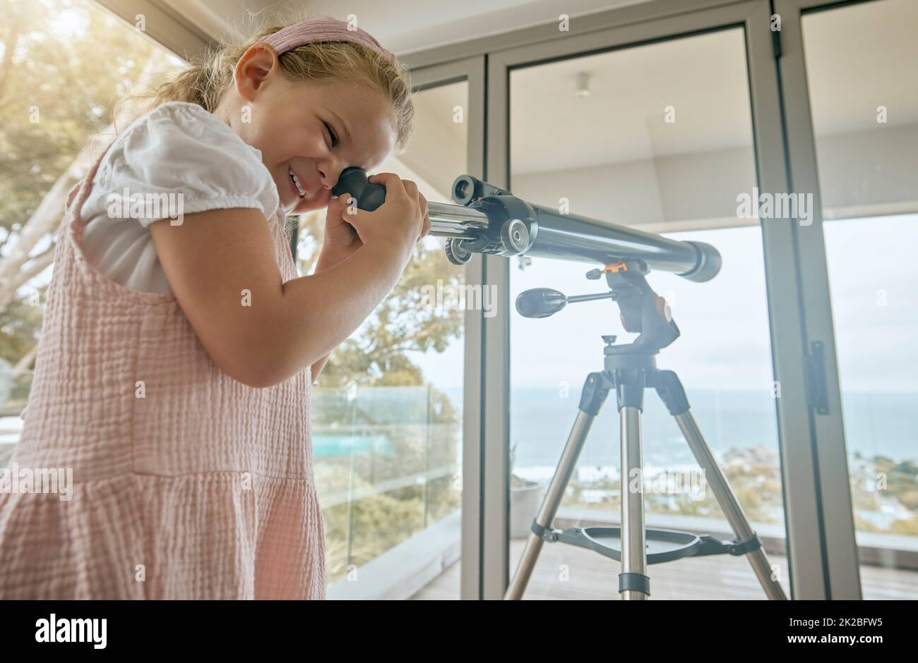 Young kids, telescope and home learning about planets, stars and sky in ...